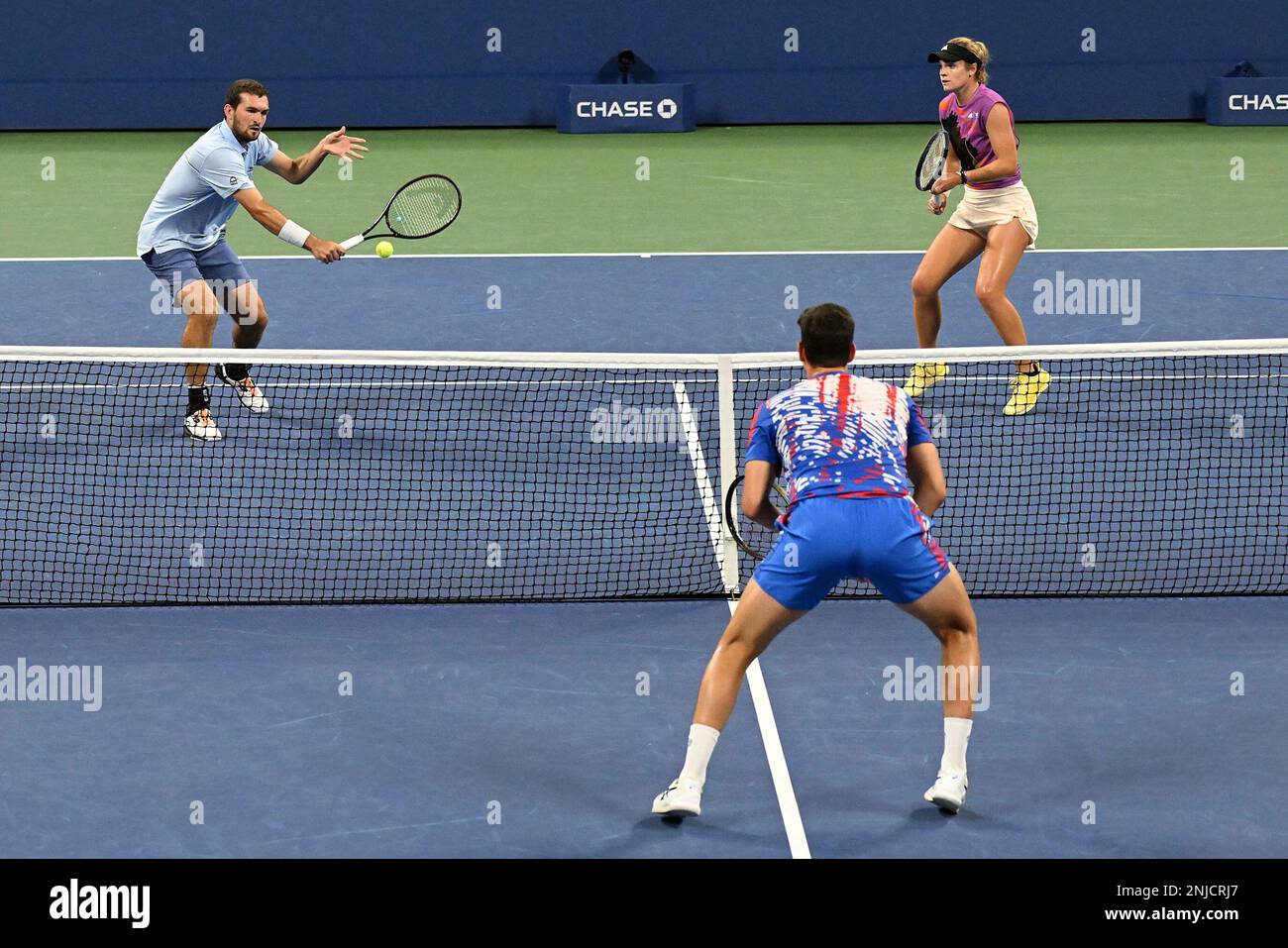 William Blumberg returns during a mixed doubles quarterfinal match at ...