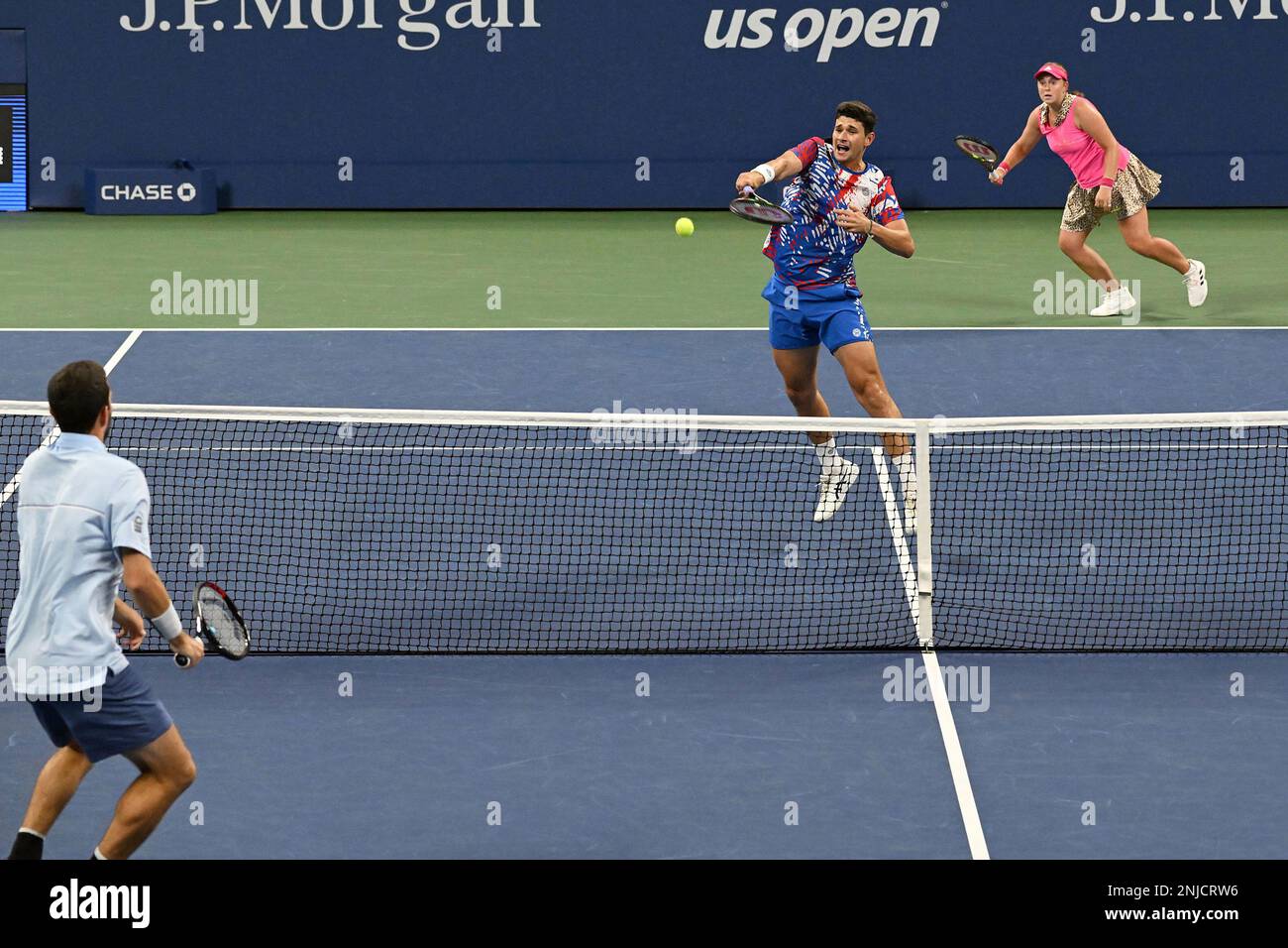 David Vega Hernandez returns during a mixed doubles quarterfinal match ...