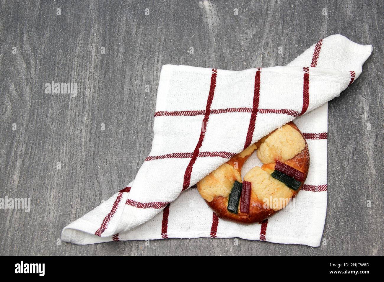 The roscon, rosca de Reyes or king cake, a torus-shaped sweet dough bun ...