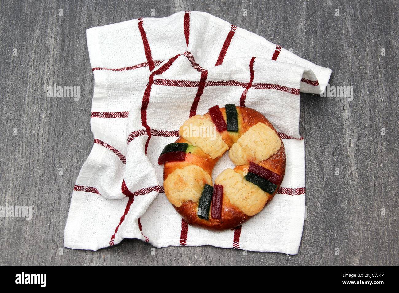 The roscon, rosca de Reyes or king cake, a torus-shaped sweet dough bun ...