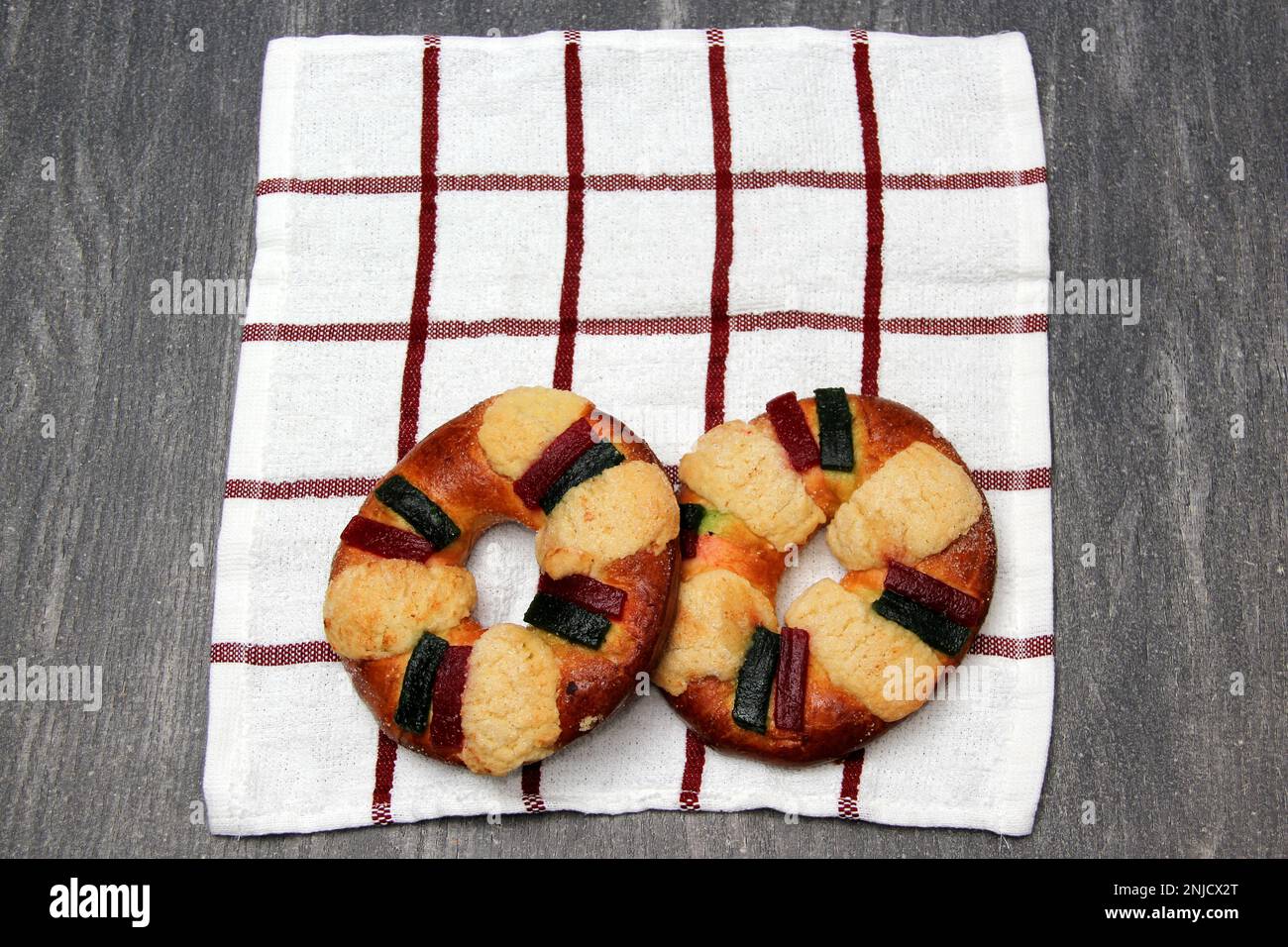 The roscon, rosca de Reyes or king cake, a torus-shaped sweet dough bun ...