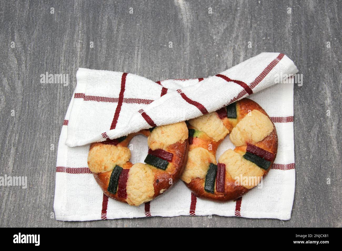The roscon, rosca de Reyes or king cake, a torus-shaped sweet dough bun ...