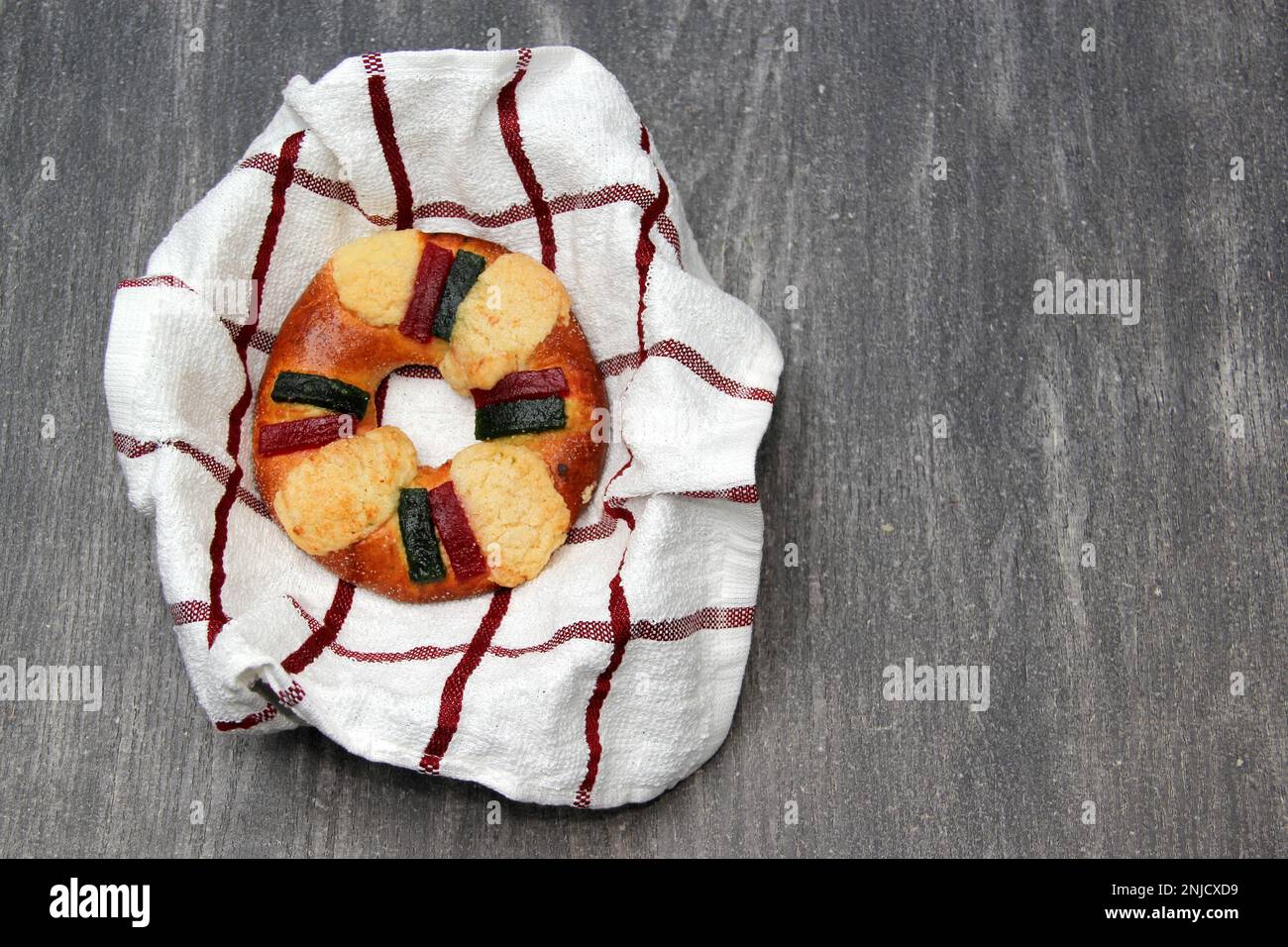 The roscon, rosca de Reyes or king cake, a torus-shaped sweet dough bun ...