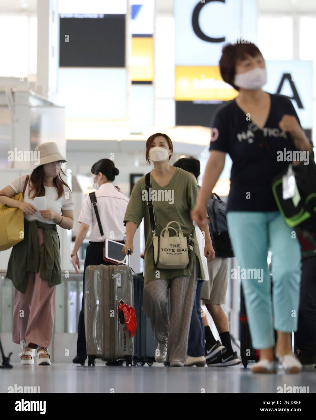 A photo shows crowded Haneda International Airport in Ota Ward, Tokyo ...