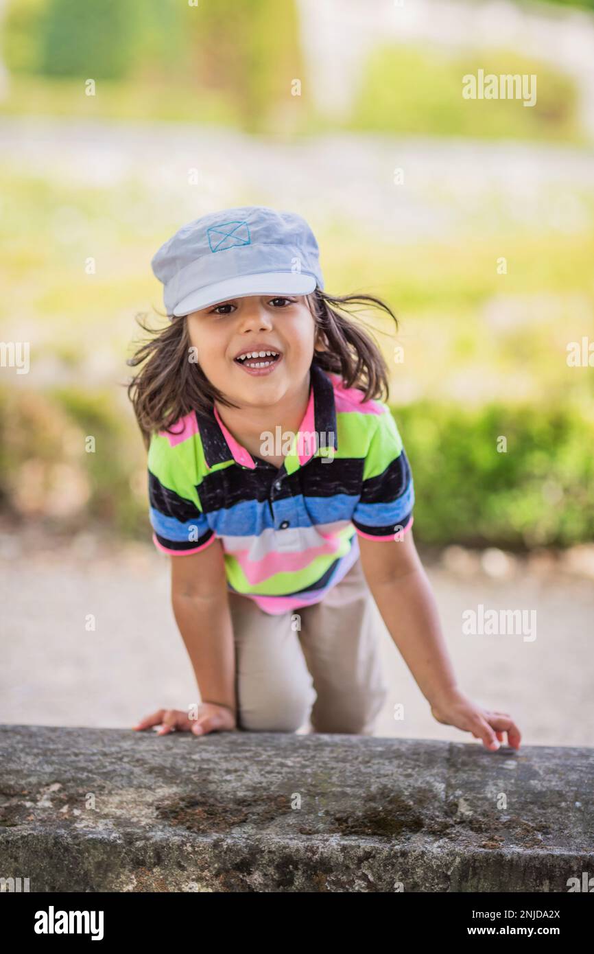 Little handsome baby boy staying outdoor in old town Stock Photo - Alamy