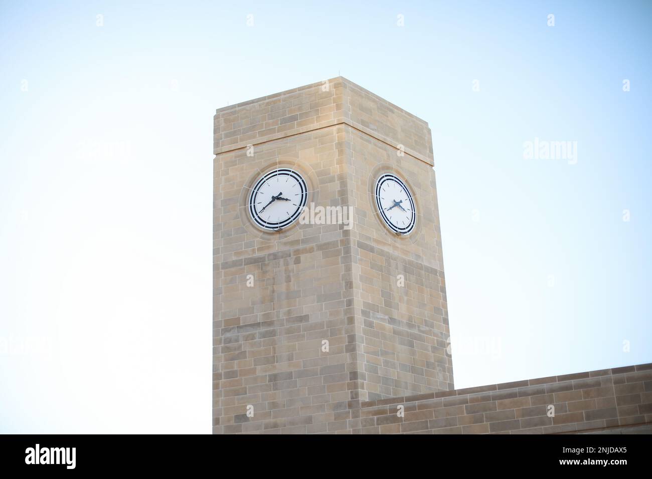 Clock tower in the city showing symbolism of time Stock Photo - Alamy