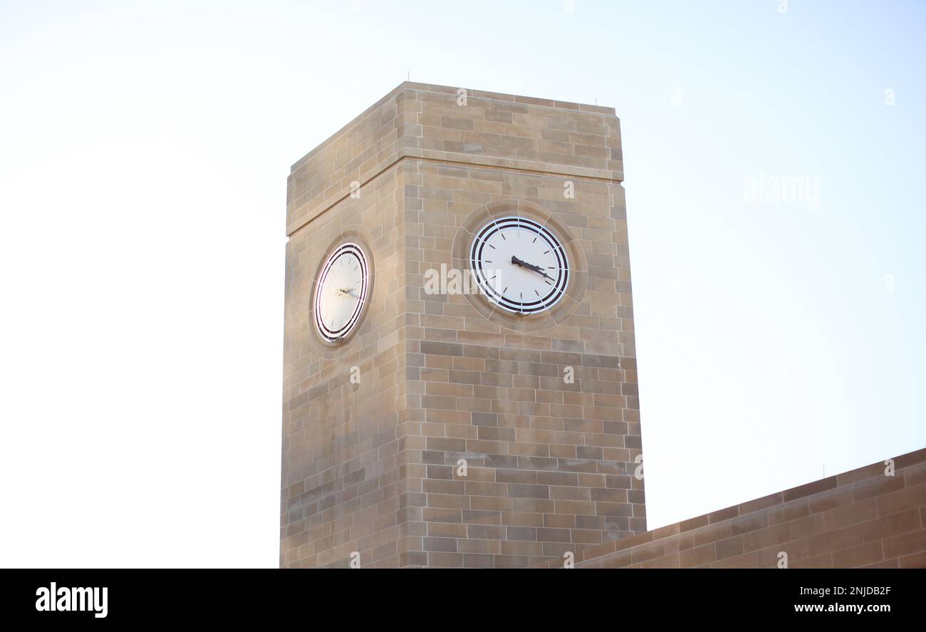 Clock tower in the city showing symbolism of time Stock Photo - Alamy