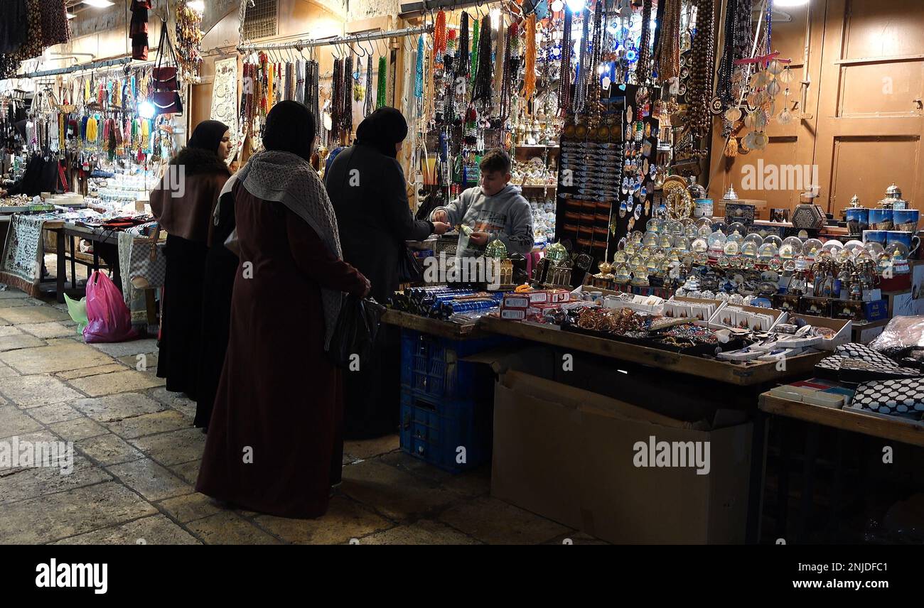 Palestinian women shopping at Cotton Merchants' Market an alley leading ...