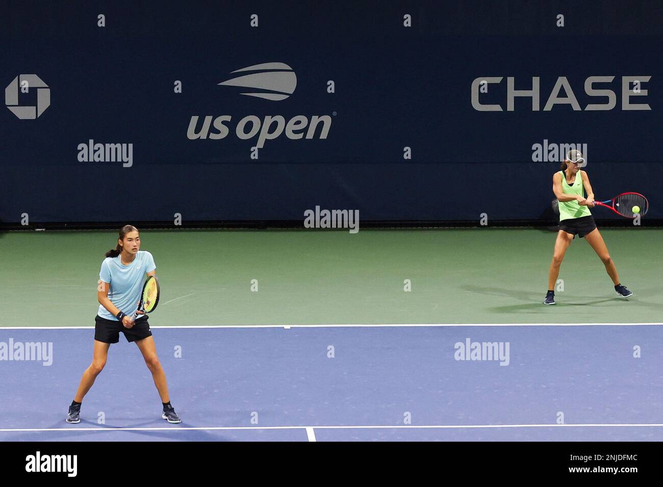 Capucine Jauffret and Alanis Hamilton in action during a junior girls ...
