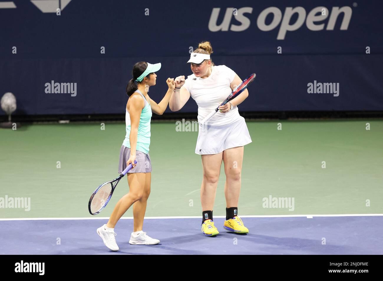 Sara Saito and Charlotte Kempenaers-Pocz in action during a junior ...
