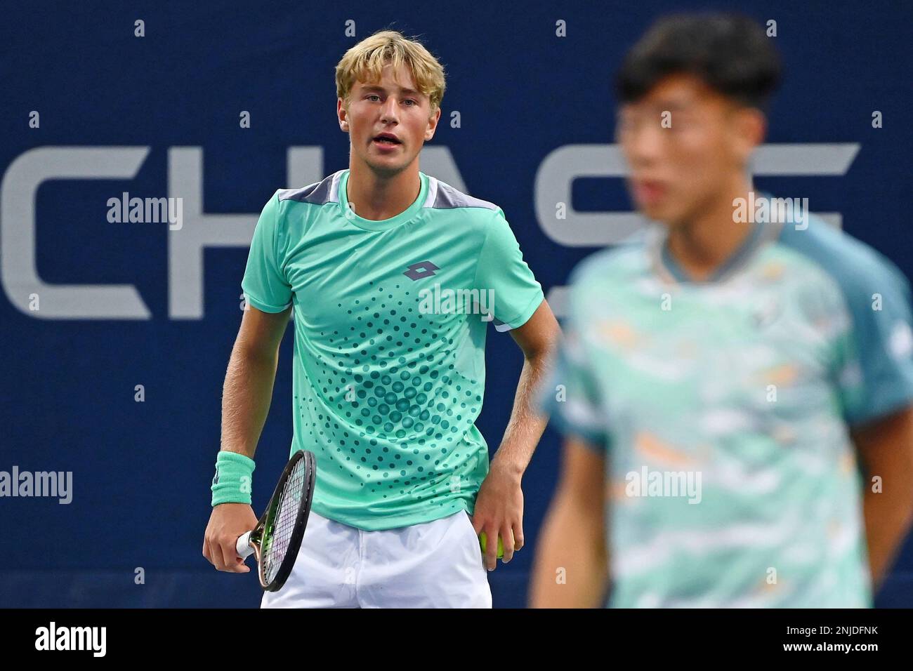 Edas Butvilas and Coleman Wong during a junior boys' doubles match at ...