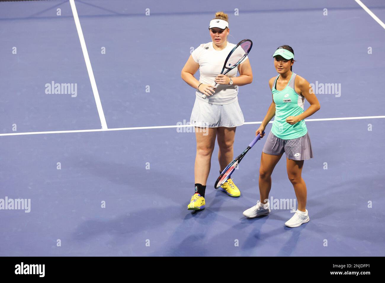 Sara Saito and Charlotte Kempenaers-Pocz in action during a junior ...