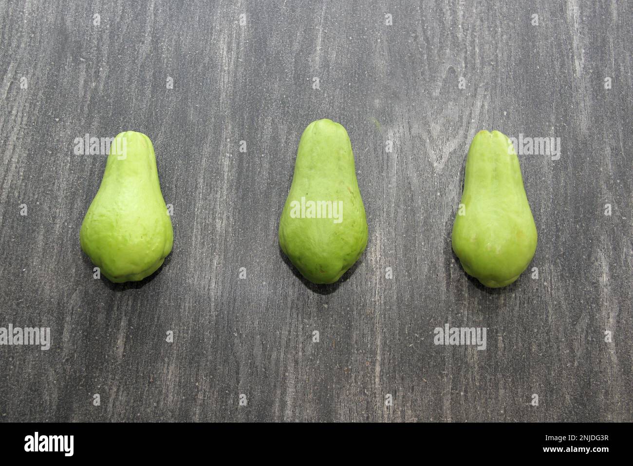 Fresh, raw and delicious freshly harvested chayotes and green squash ...