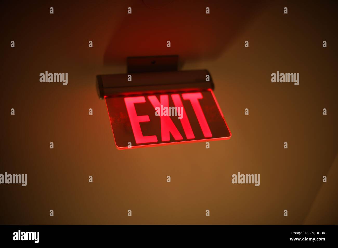 Hallway exit sign vibrant in corridor showing evacuation during ...