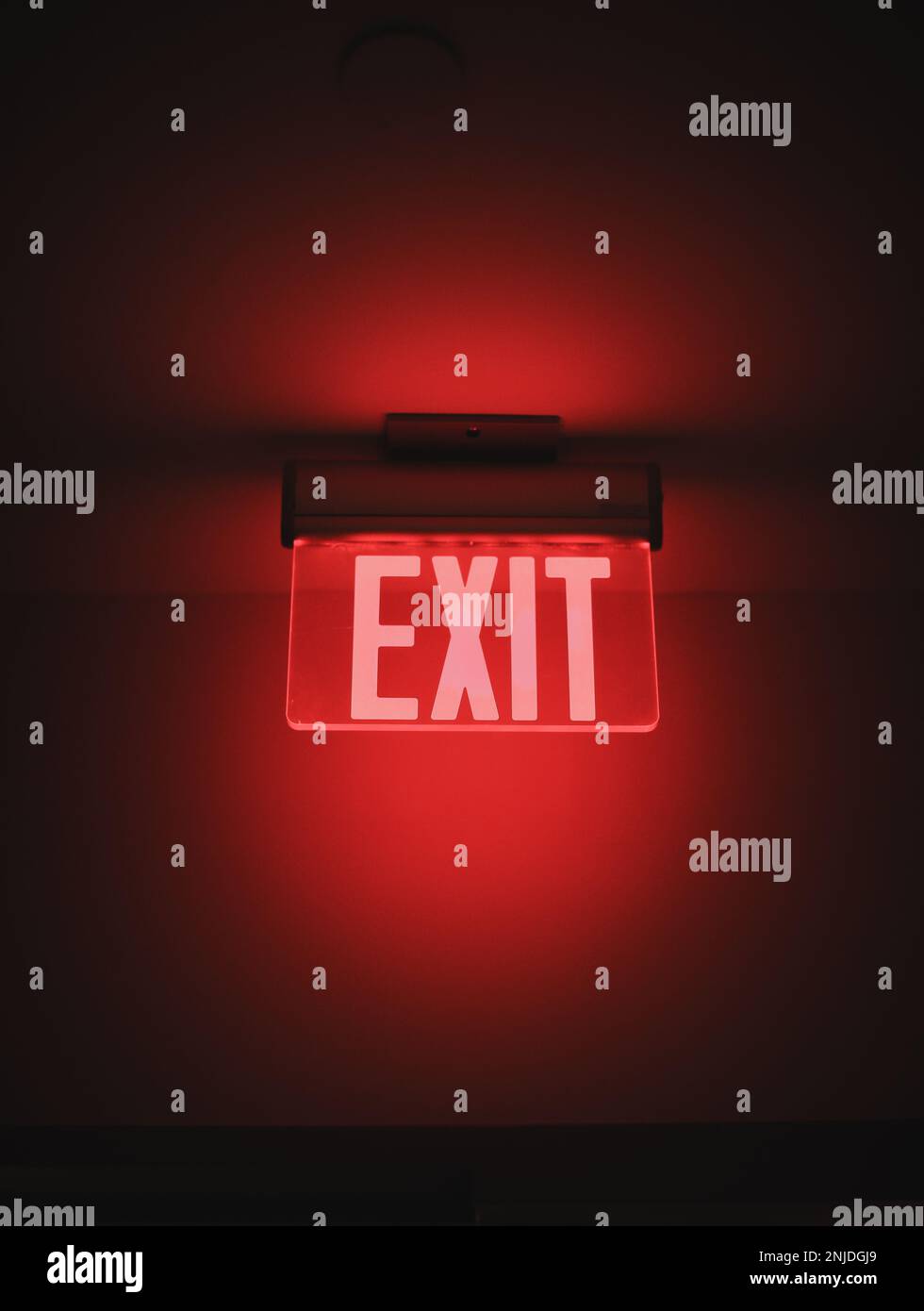 Hallway exit sign vibrant in corridor showing evacuation during ...
