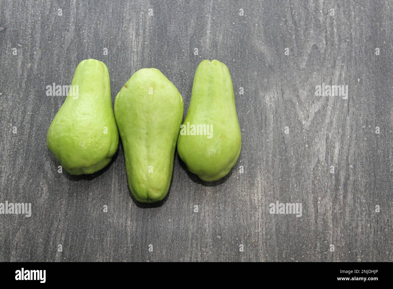 Fresh, raw and delicious freshly harvested chayotes and green squash ...