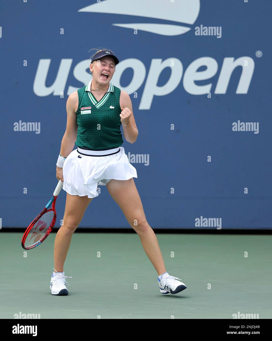 Celine Naef reacts during a junior girls' singles match at the 2022 US ...