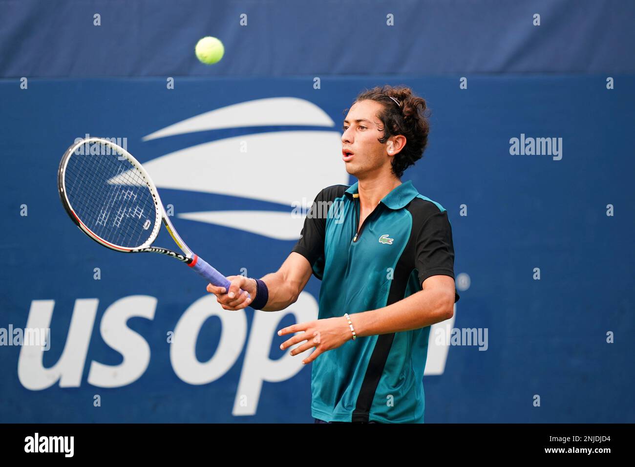 Ozan Baris in action during a junior boys' singles match at the 2022 US ...