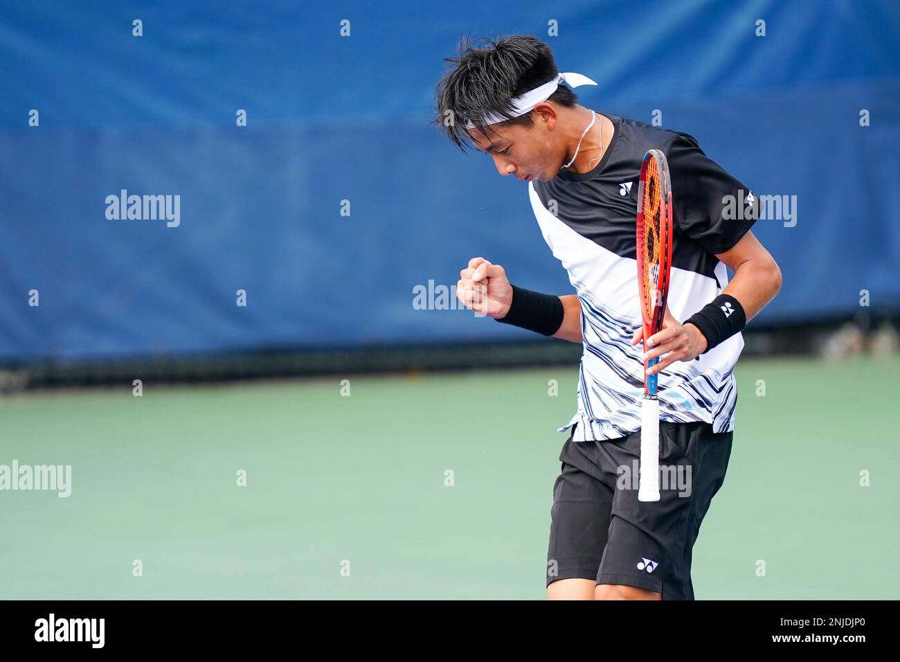 Aidan Kim reacts during a junior boys' singles match at the 2022 US ...