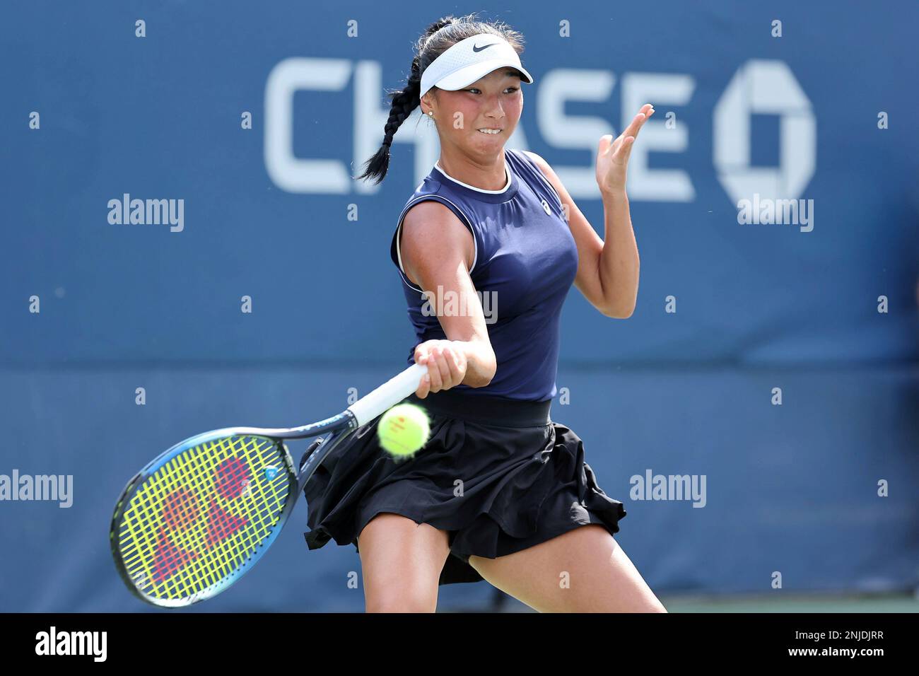 Aruzhan Sagandikova returns during a junior girls' singles match at the 2022 US Open, Monday ...
