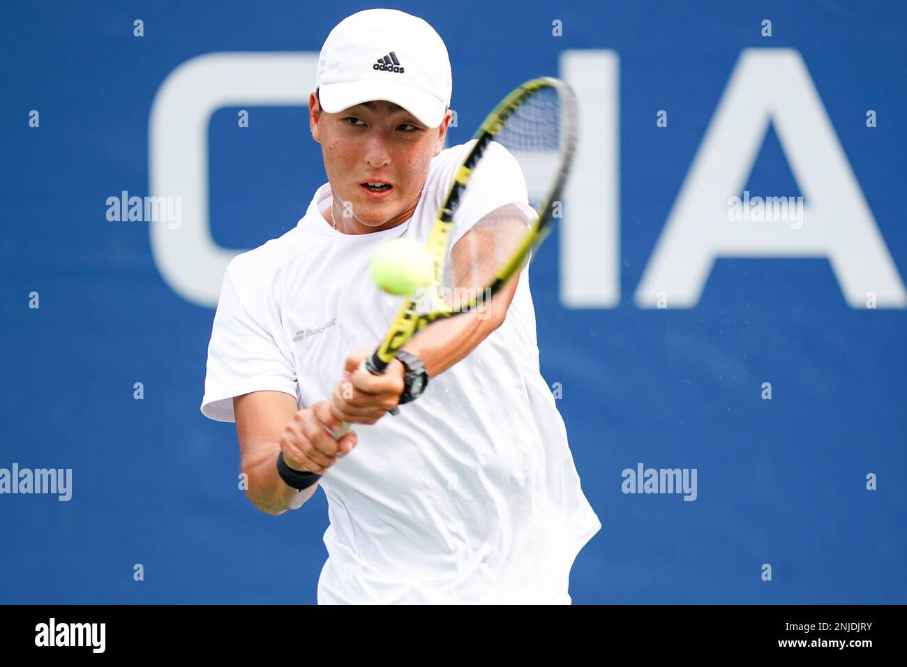 Kyle Kang in action during a junior boys' singles match at the 2022 US ...