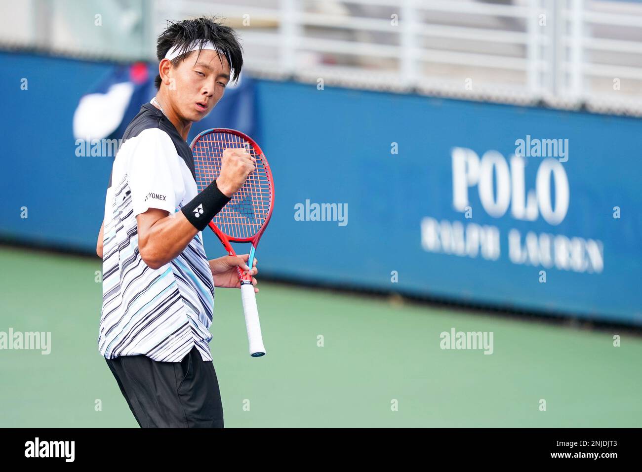 Aidan Kim reacts during a junior boys' singles match at the 2022 US ...