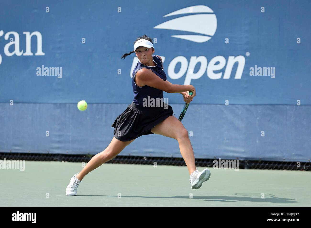 Aruzhan Sagandikova returns during a junior girls' singles match at the 2022 US Open, Monday ...