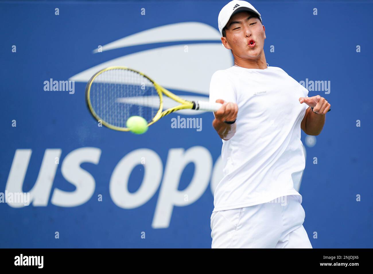 Kyle Kang in action during a junior boys' singles match at the 2022 US ...