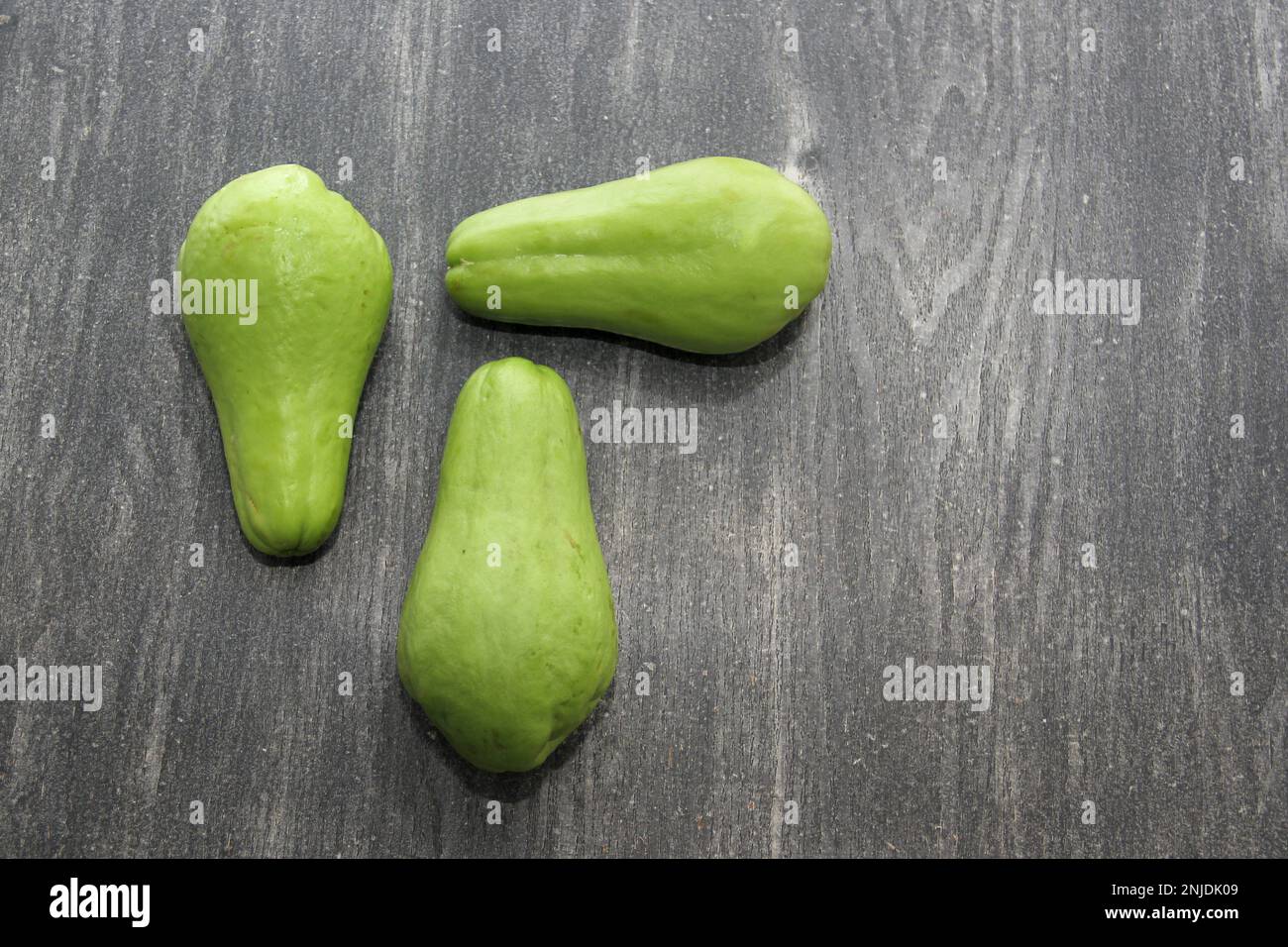 Fresh, raw and delicious freshly harvested chayotes and green squash ...
