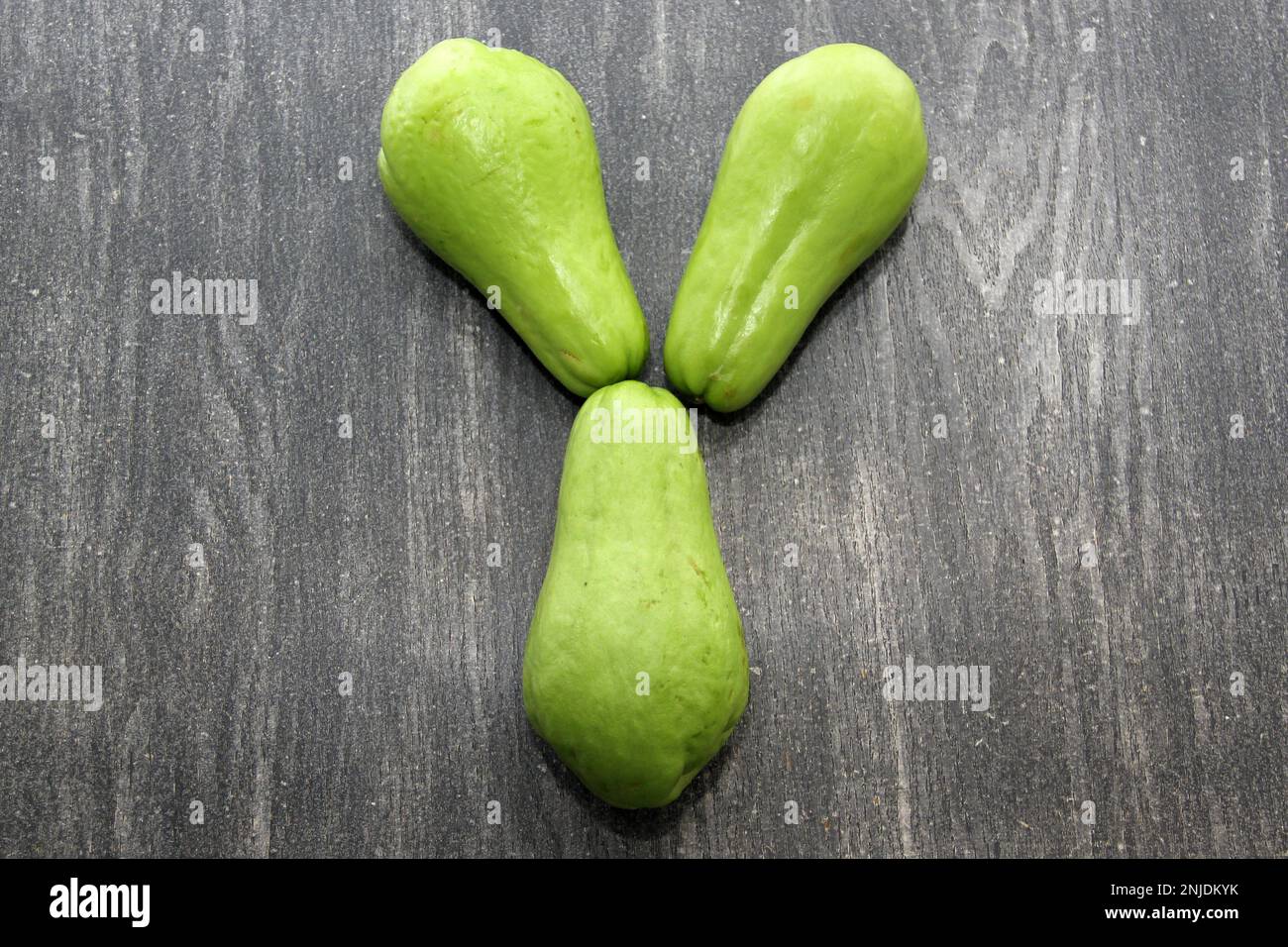Fresh, raw and delicious freshly harvested chayotes and green squash ...