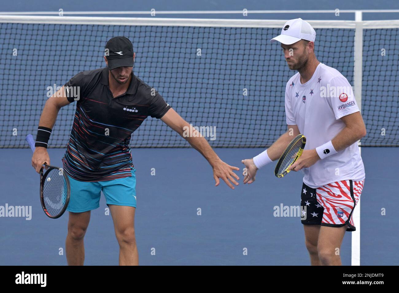 Tim Puetz and Michael Venus in action during a men's doubles match at ...