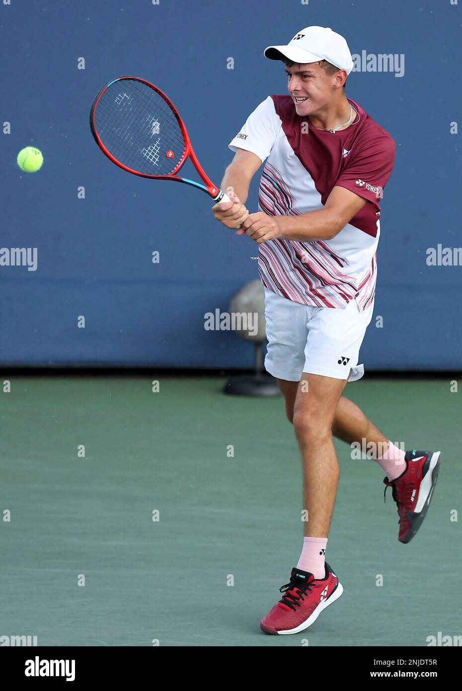 Kaylan Bigun returns during a junior boys' singles match at the 2022 US ...