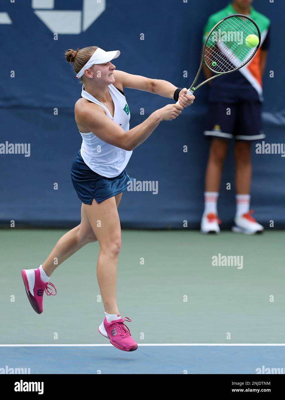 Amelia Waligora returns during a junior girls' singles match at the ...