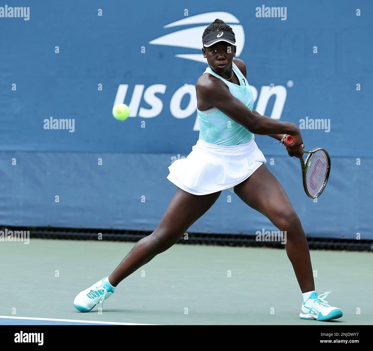 Victoria Mboko returns during a junior girls' singles match at the 2022 ...