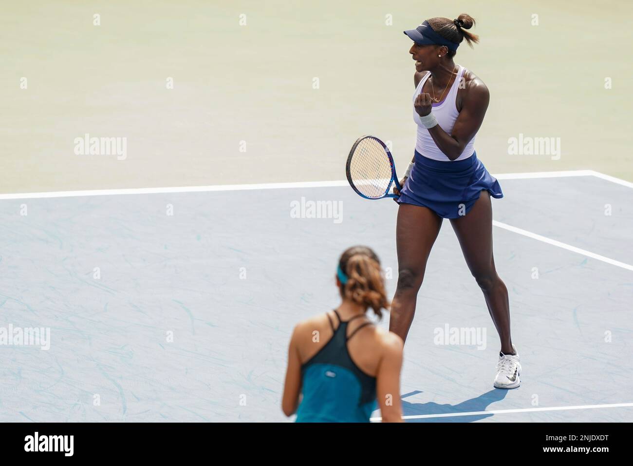 Asia Muhammad and Ena Shibahara in action during a women's doubles ...
