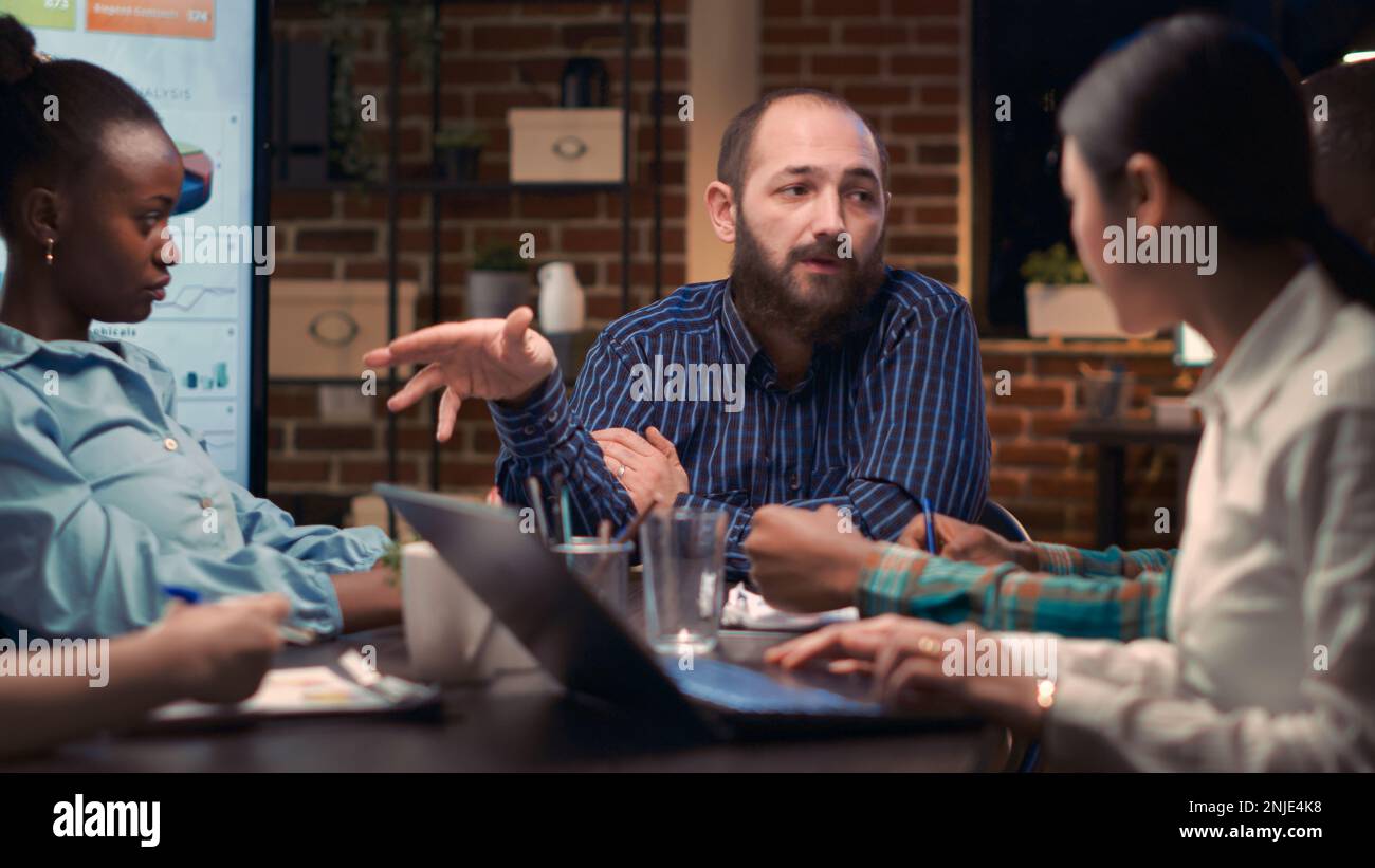 Business meeting, man explaining marketing strategy plan, coworkers ...