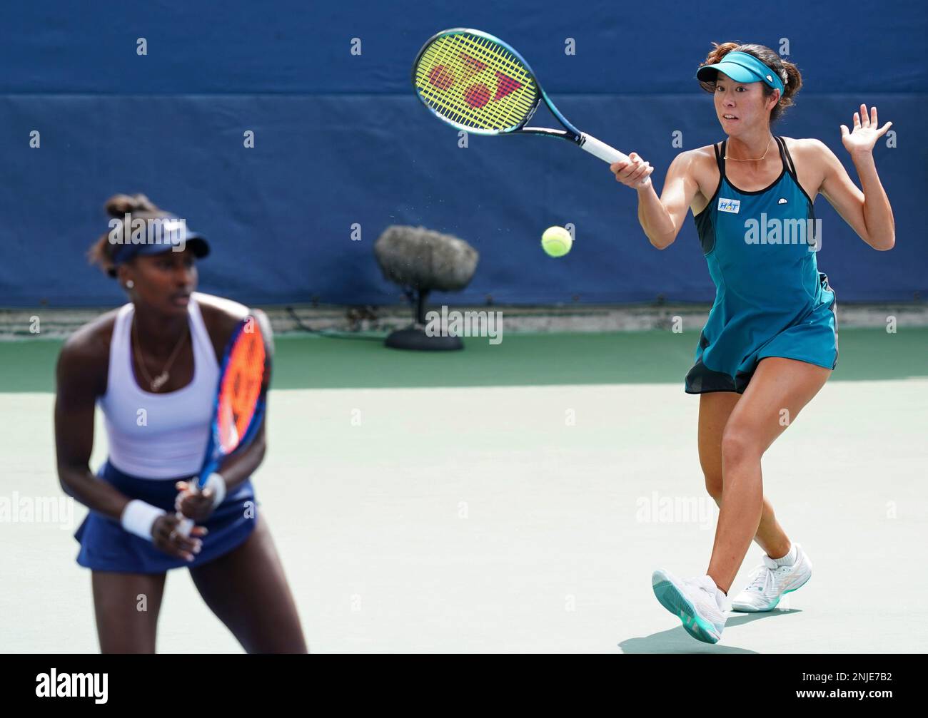 Ena Shibahara and Asia Muhammad in action during a women's doubles ...