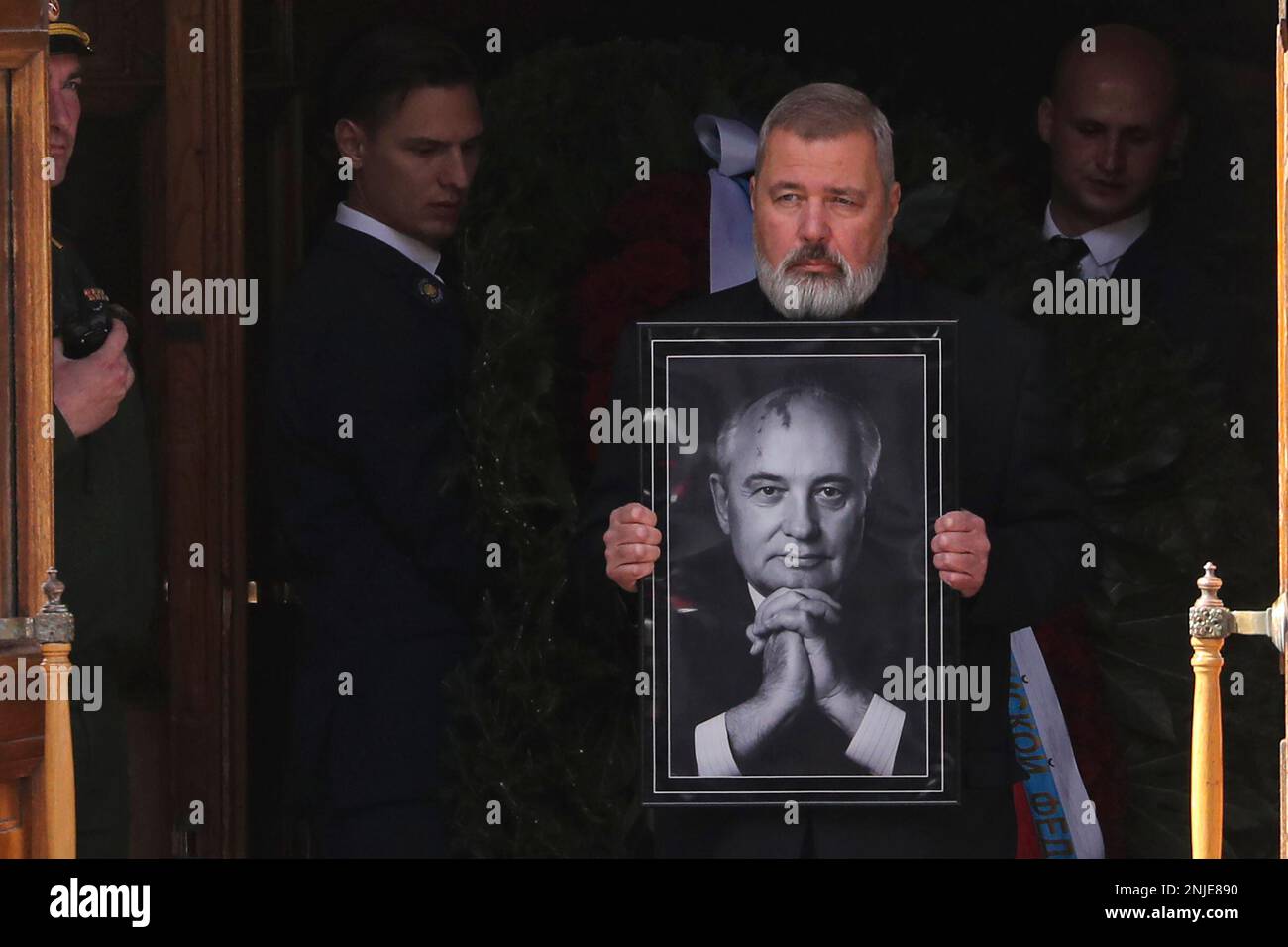 Nobel Peace Prize awarded journalist Dmitry Muratov carries a portrait of the late former Soviet ...