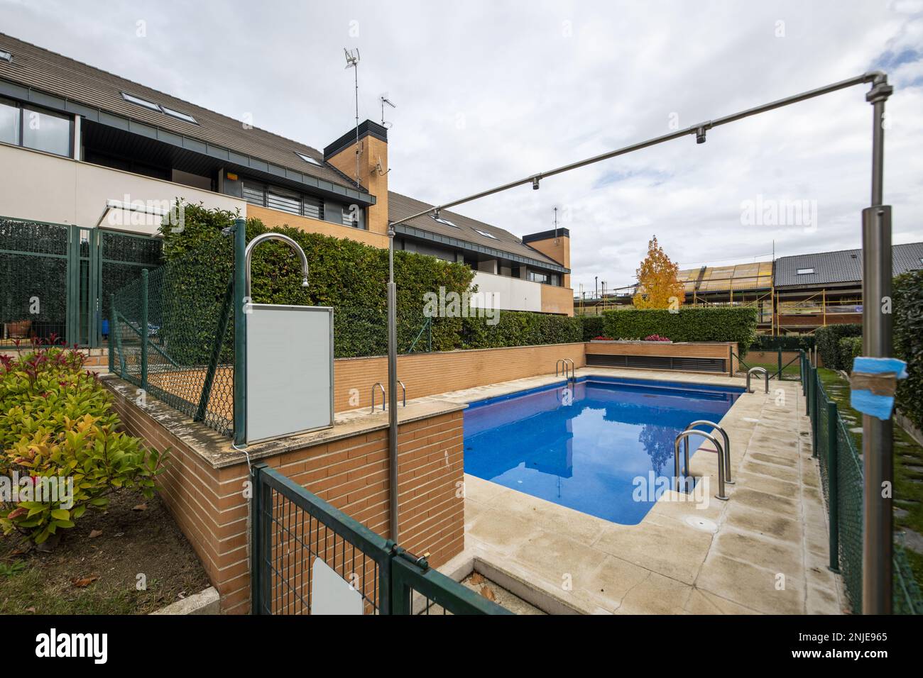 Private summer pool of a development of semi-detached single-family ...