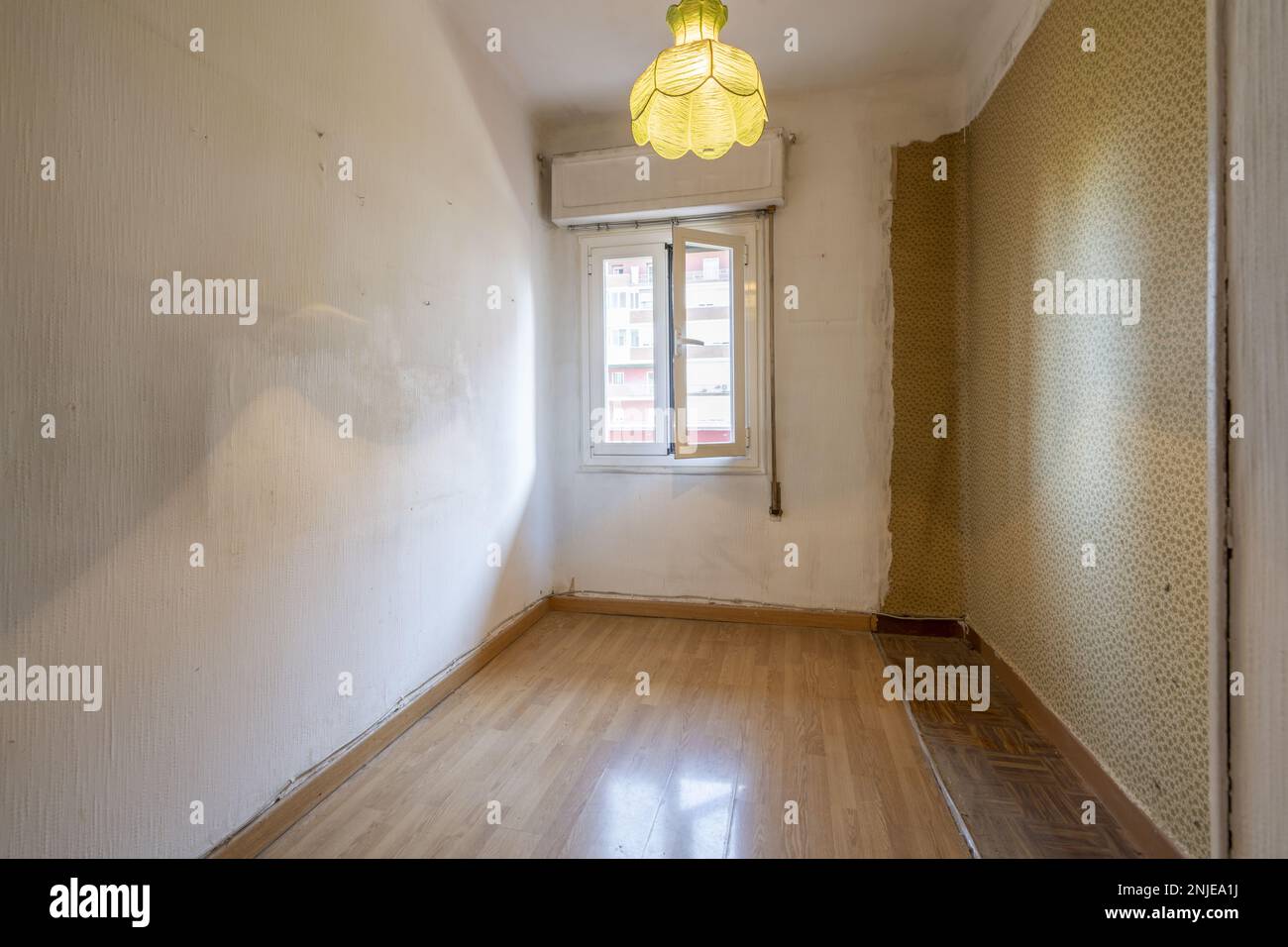 Empty room of an old house with raised wooden floors to fix, white ...
