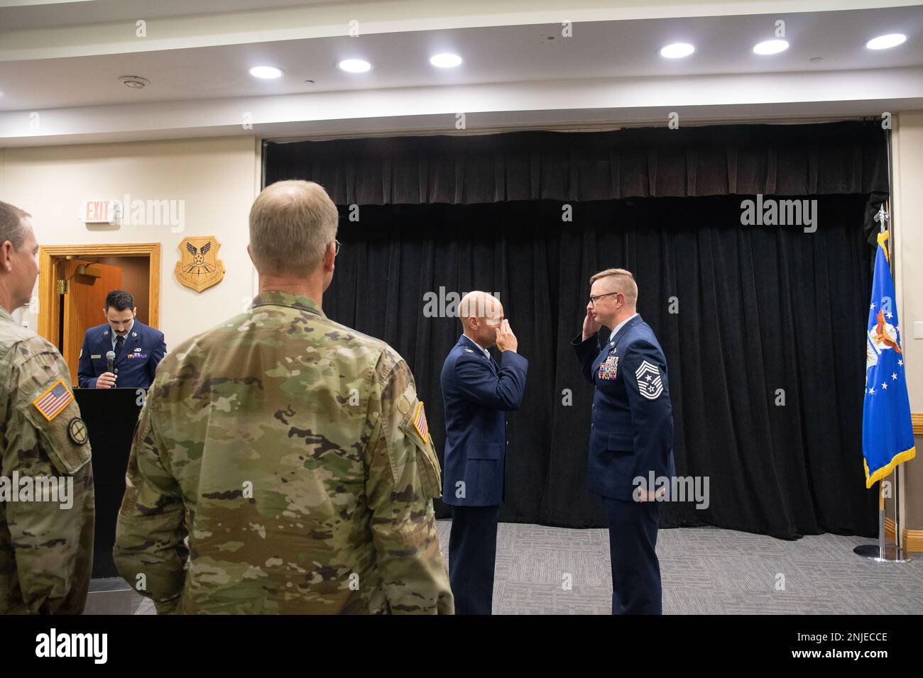 131st Bomb Wing Command Chief Master Sergeant Jason Henke exchanges a ...