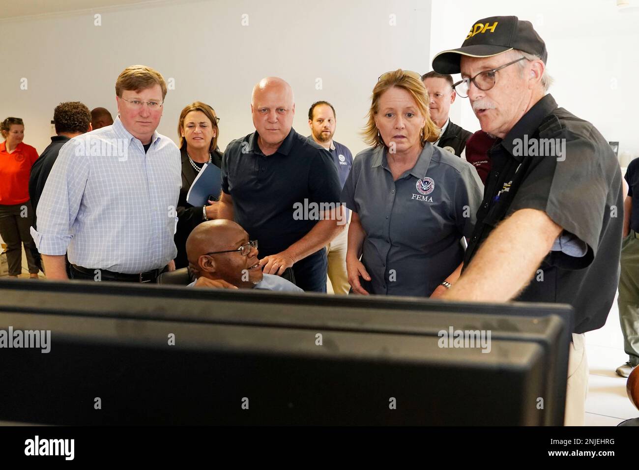 Jim Craig, with the Mississippi State Department of Health, right ...