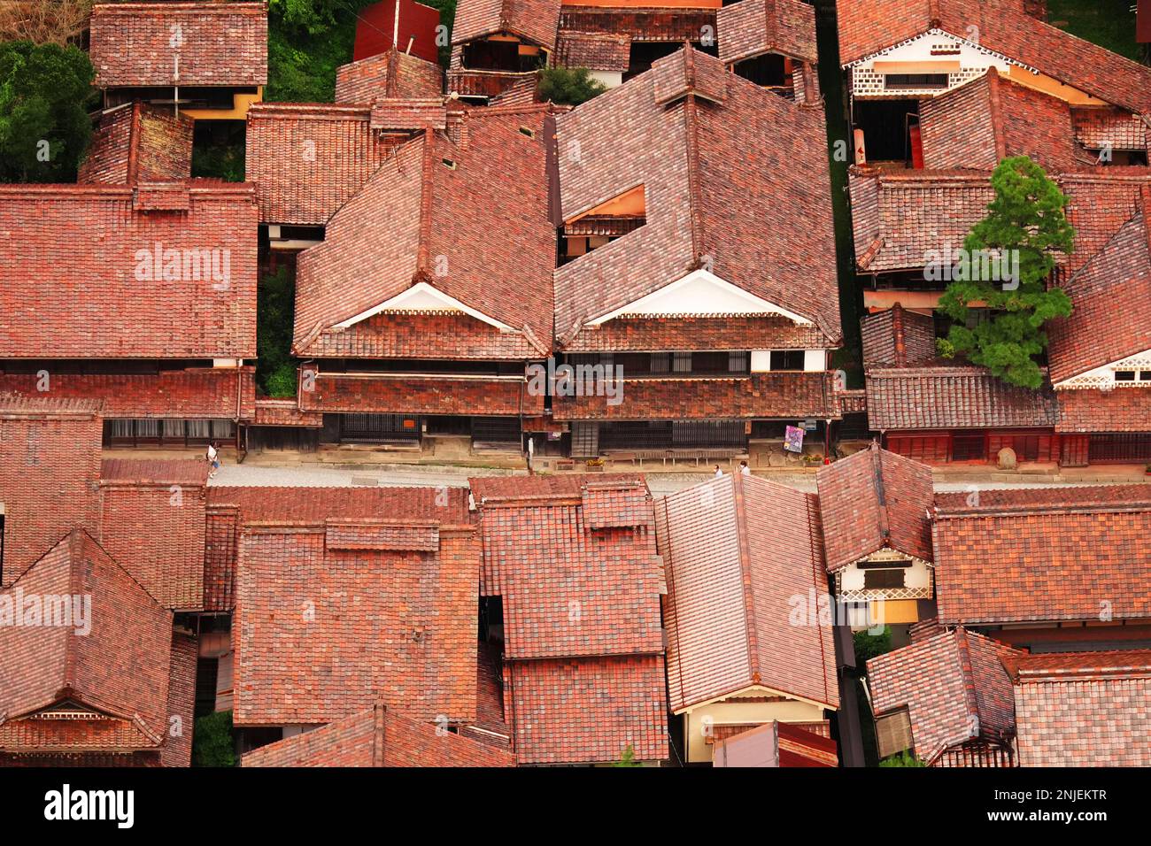 An aerial photo shows the townscape of the red iron oxide colored roof ...
