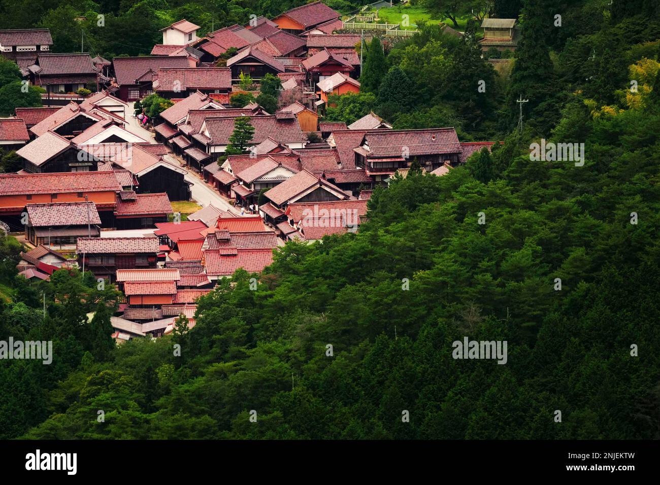 An aerial photo shows the townscape of the red iron oxide colored roof ...