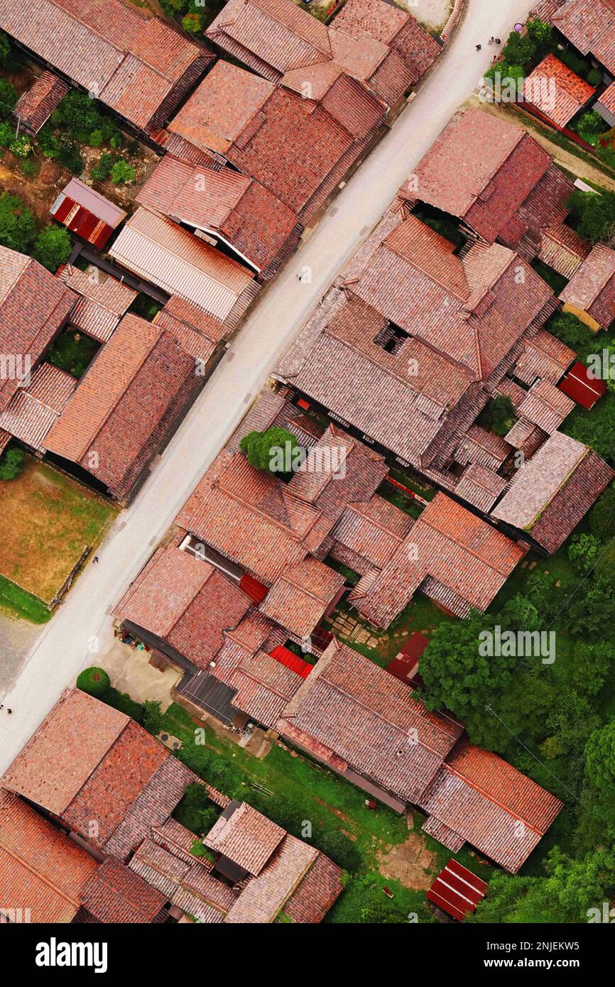 An aerial photo shows the townscape of the red iron oxide colored roof ...