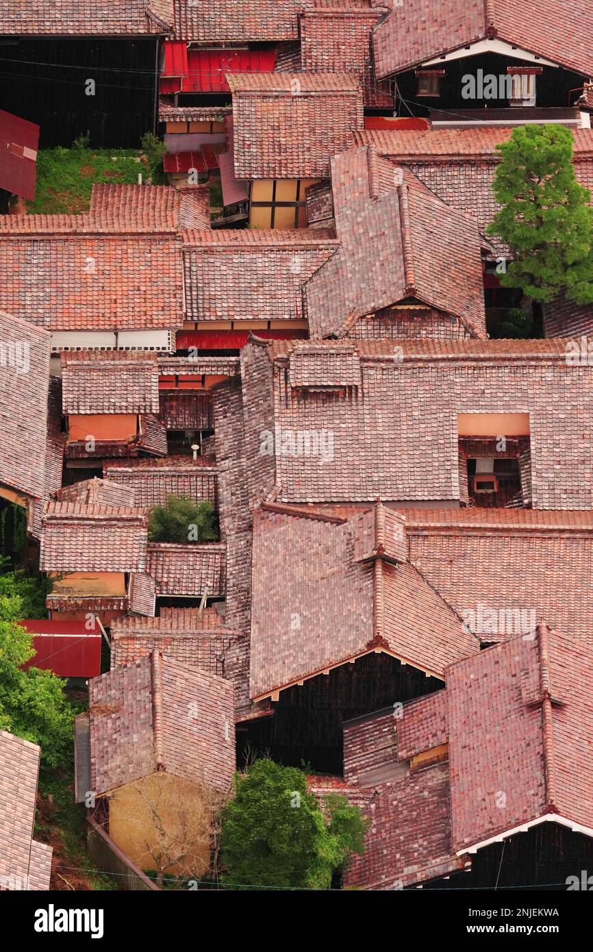 An aerial photo shows the townscape of the red iron oxide colored roof ...