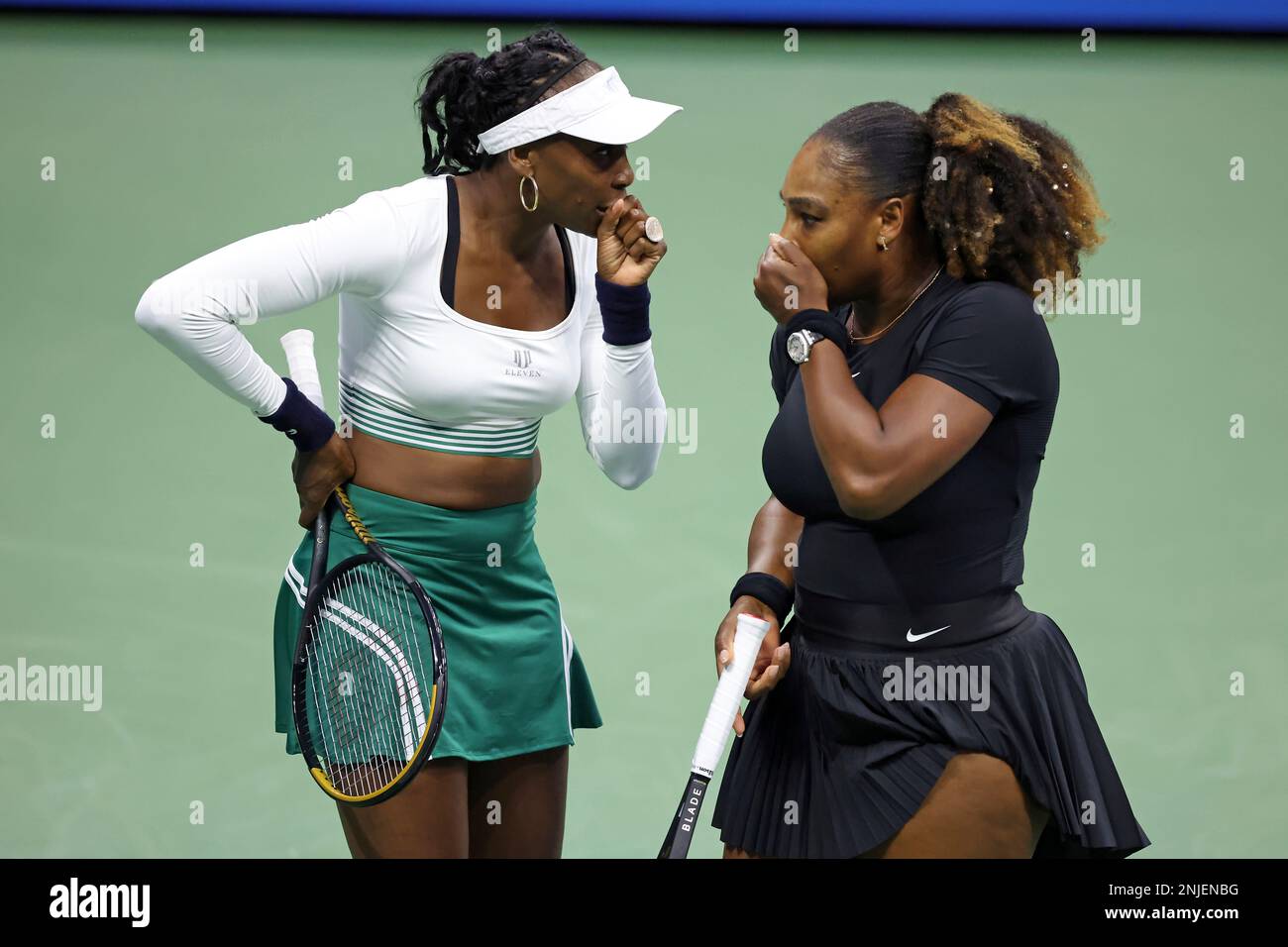 Venus Williams and Serena Williams during a women's doubles match at ...