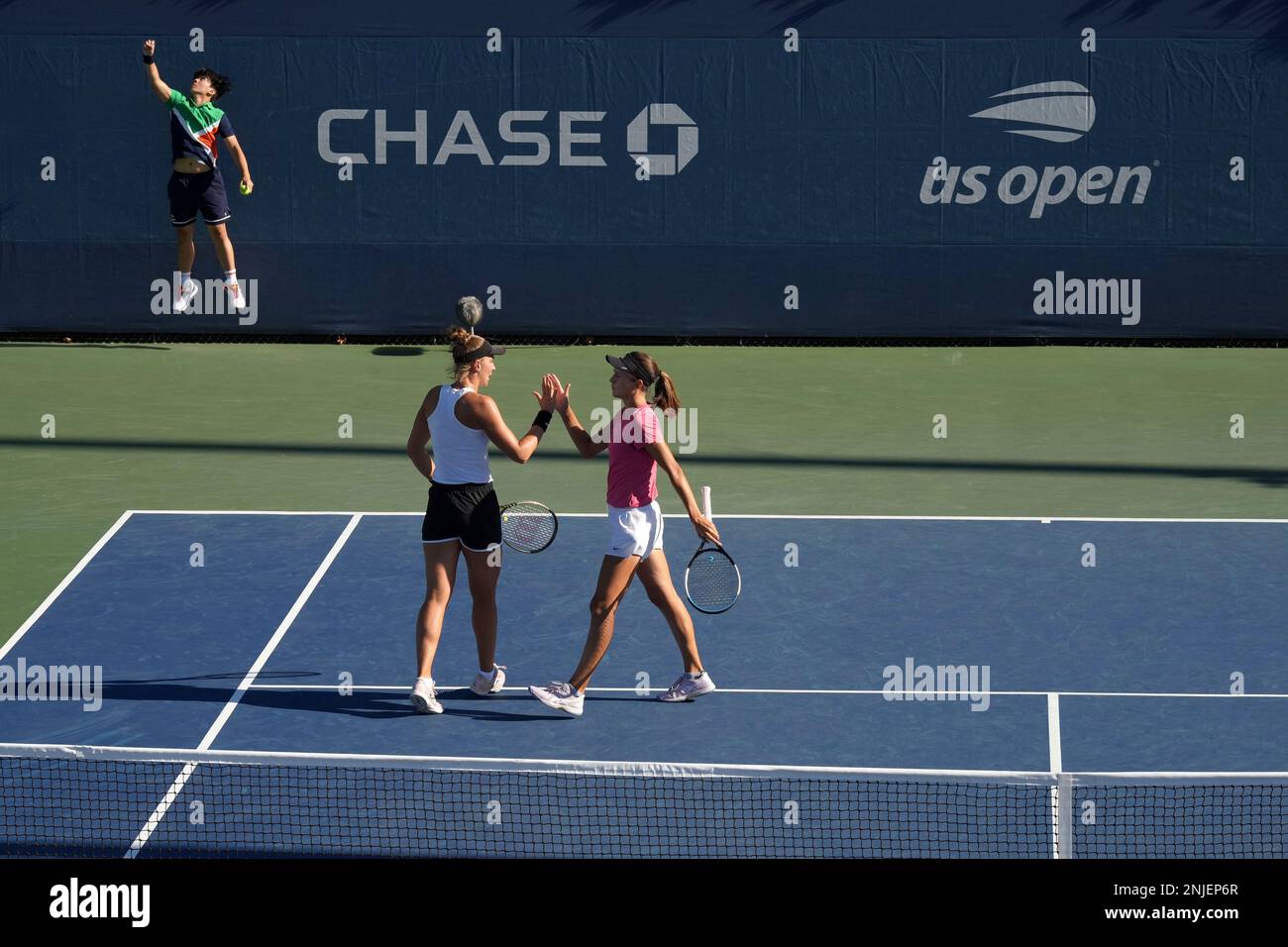 Anna Danilina and Beatriz Haddad Maia high five during a women's ...