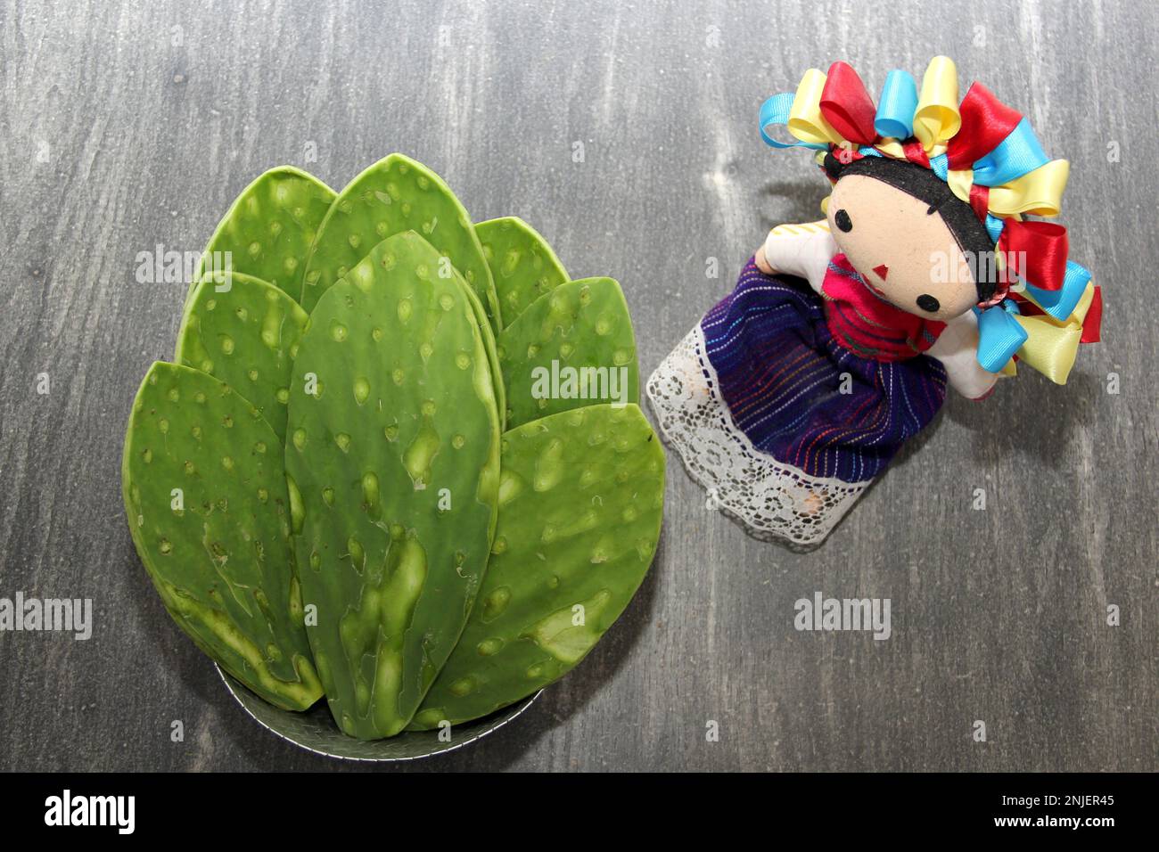 Festive Mexican objects: handmade doll and tricolor tie bow next to ...