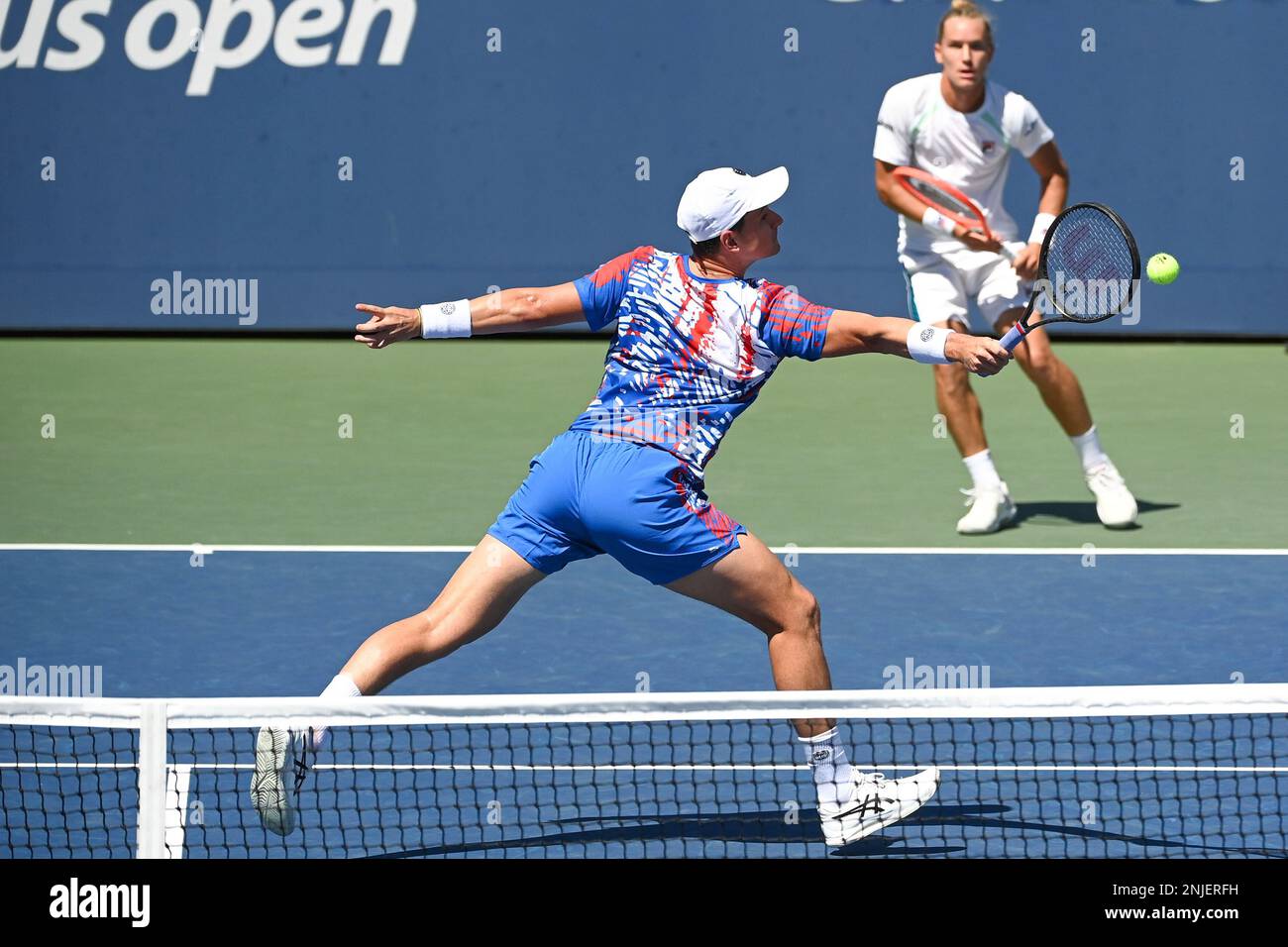 Rafael Matos and David Vega Hernandez in action during a men's doubles ...